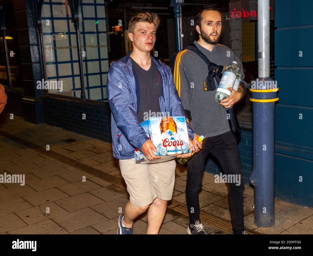 Two men carry hi-res stock photography and images - Alamy