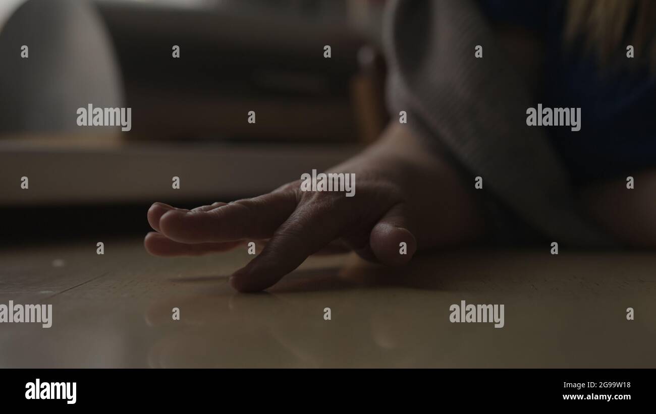 Woman sitting behind the table and finger tapping, waiting for ...