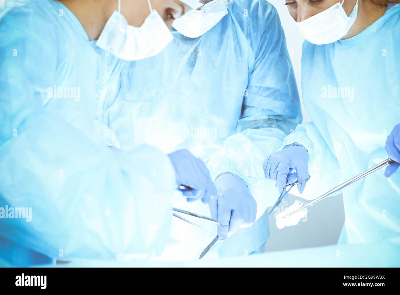 A group of surgeons is operating at the hospital. Health care concept ...