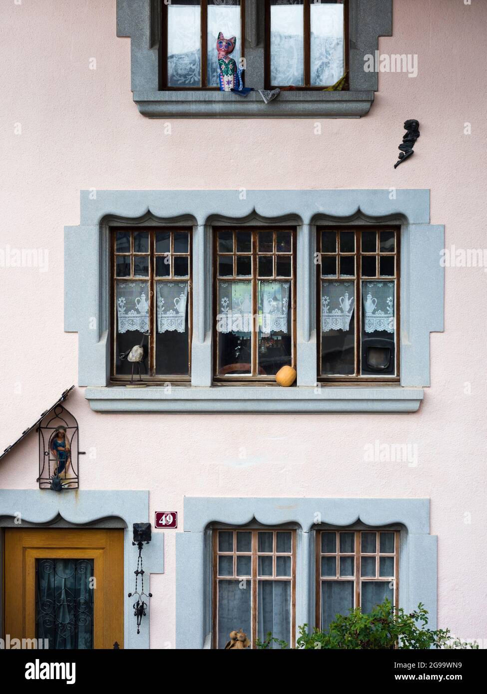 Ornamented windows and facade of a traditional Swiss building in the ...