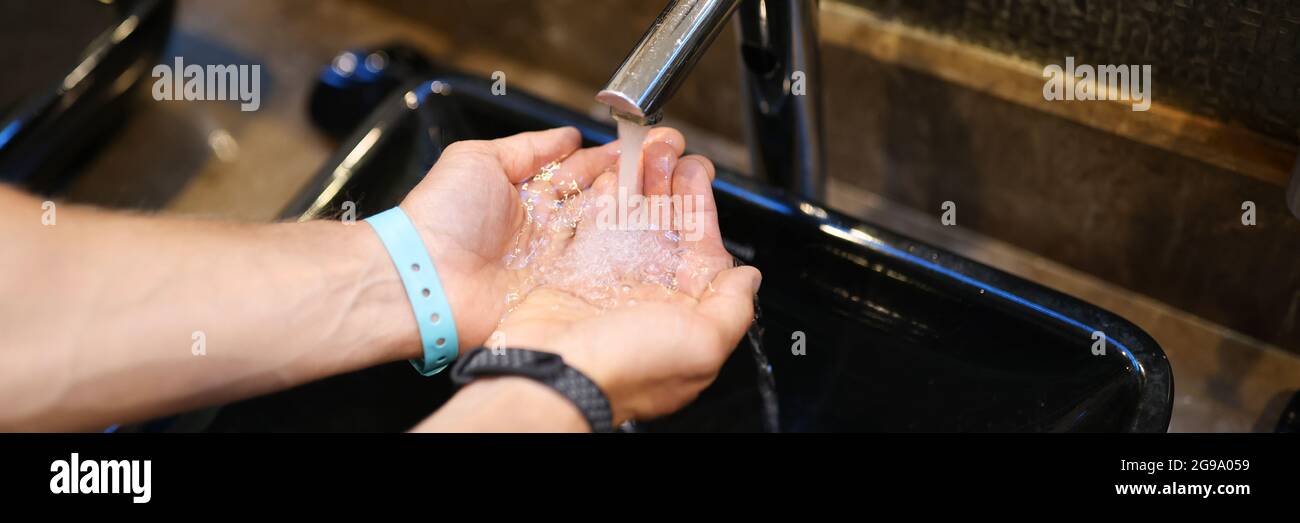 Washing hands in sink. Clean hands guarantee health Stock Photo - Alamy