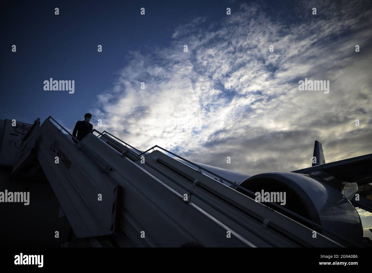 France's President Emmanuel Macron leaves his plane on the tarmac upon ...