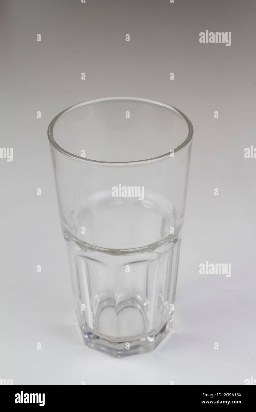 Empty glass. isolated on a white background Stock Photo - Alamy