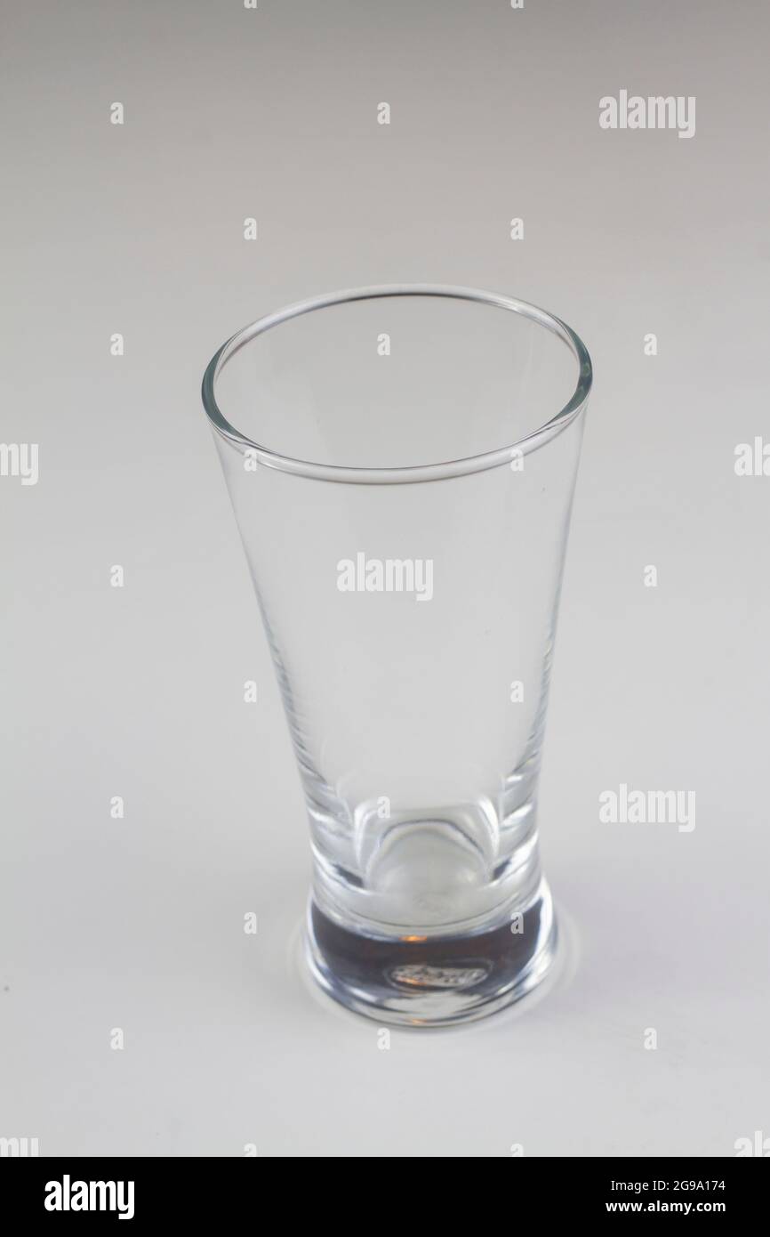 Empty glass. isolated on a white background Stock Photo - Alamy