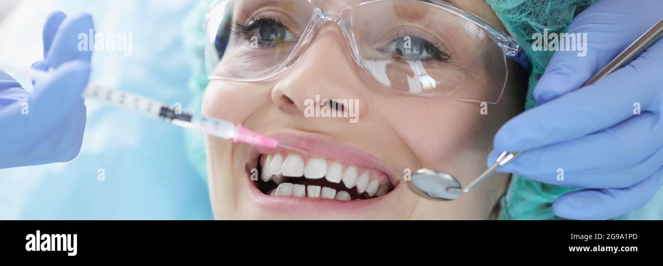 Doctor gives woman an anesthetic injection closeup Stock Photo - Alamy