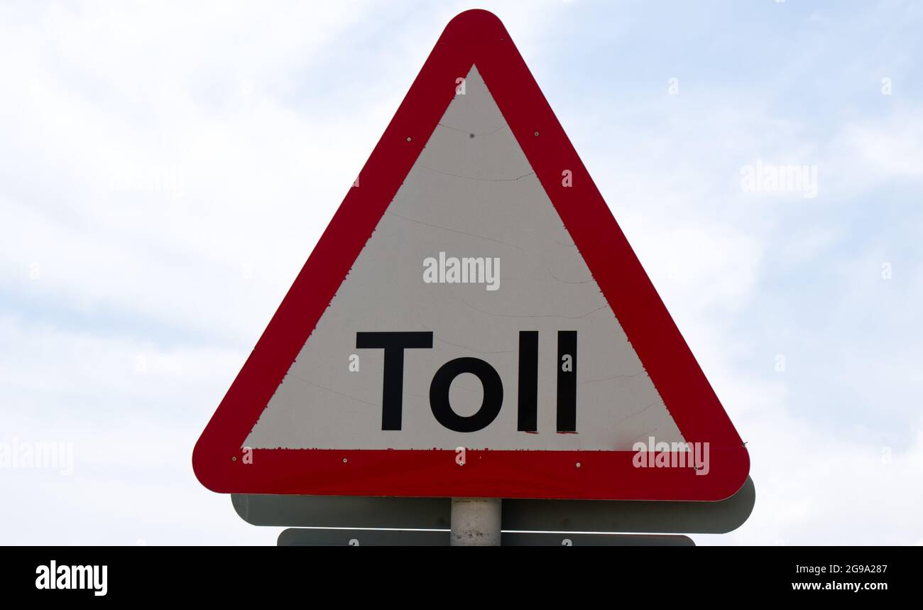 Triangular toll warning sign hi-res stock photography and images - Alamy