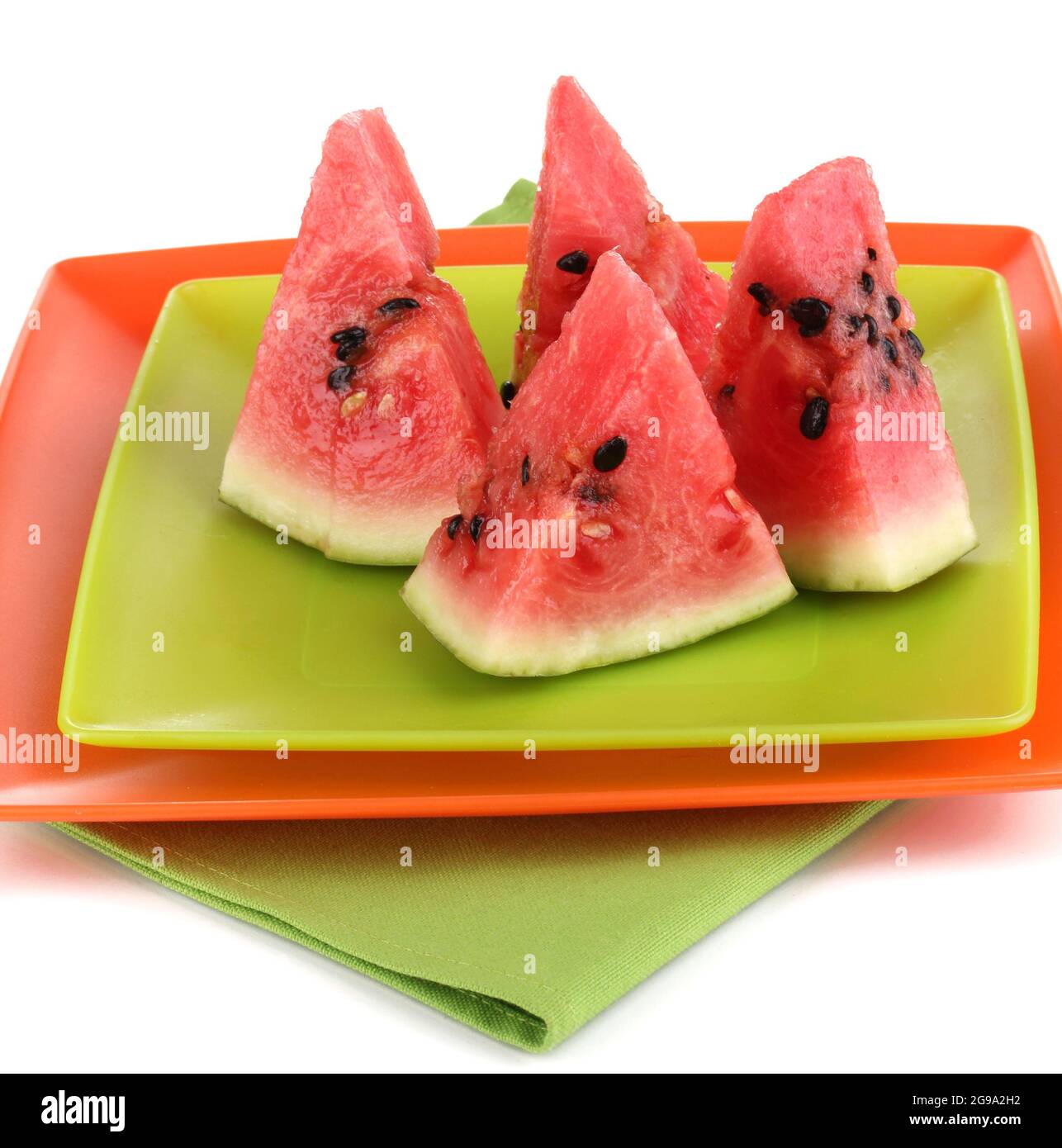 Sweet watermelon slices on plates isolated on white Stock Photo - Alamy