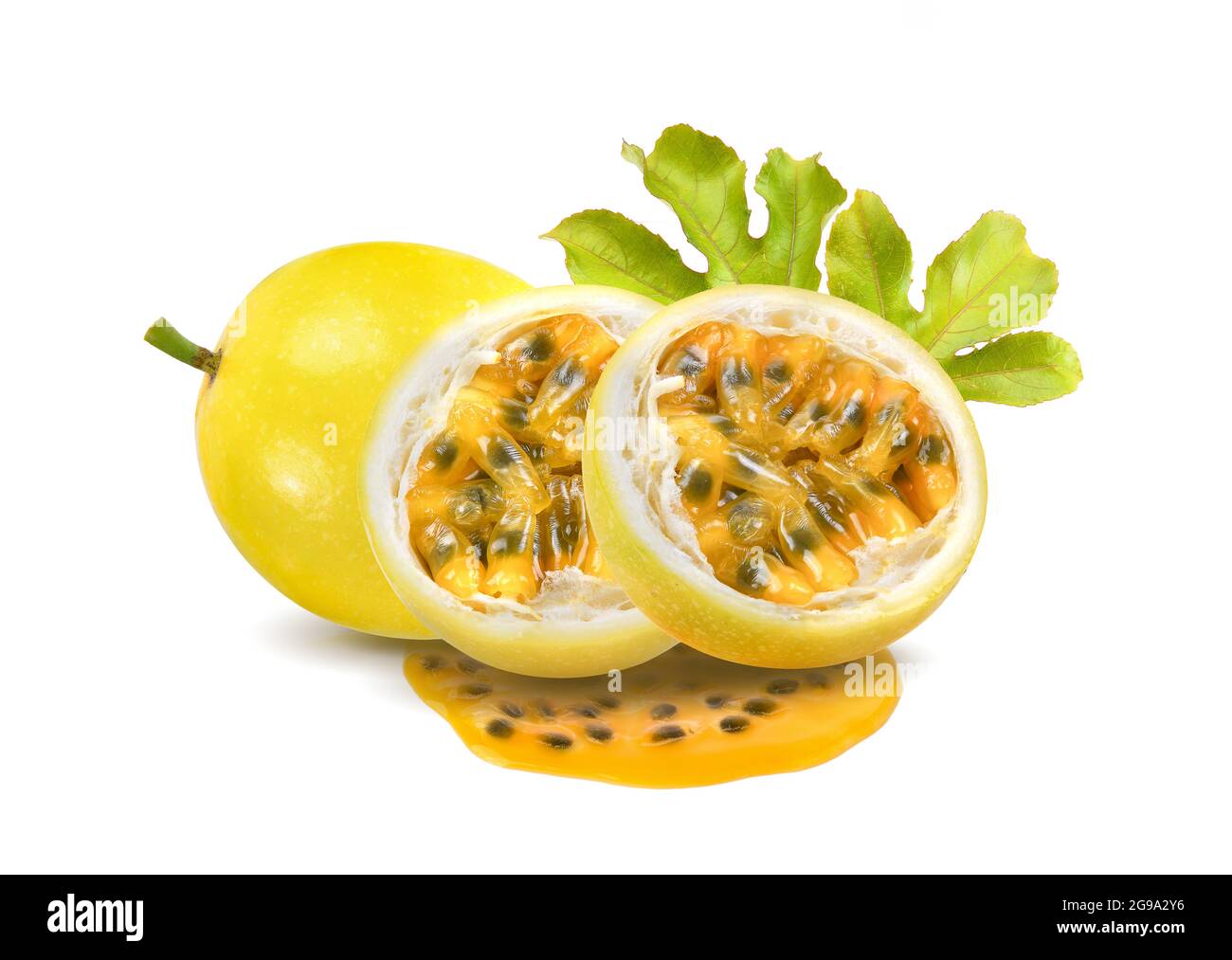 yellow passion fruit with leaf on white background Stock Photo - Alamy