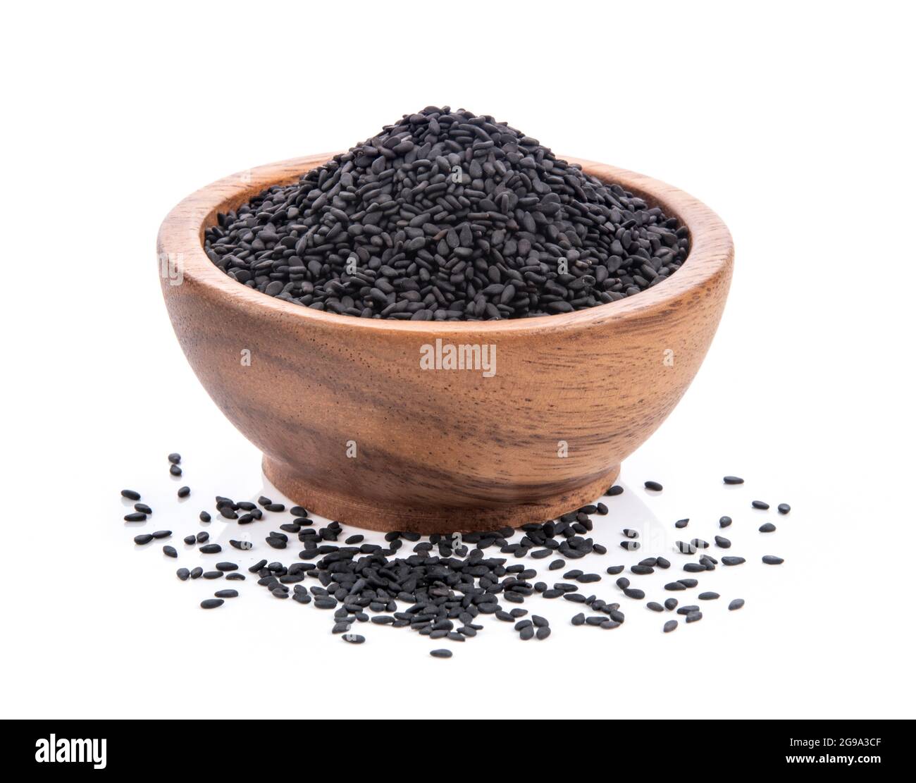 sesame in wood bowl isolated on white background Stock Photo - Alamy