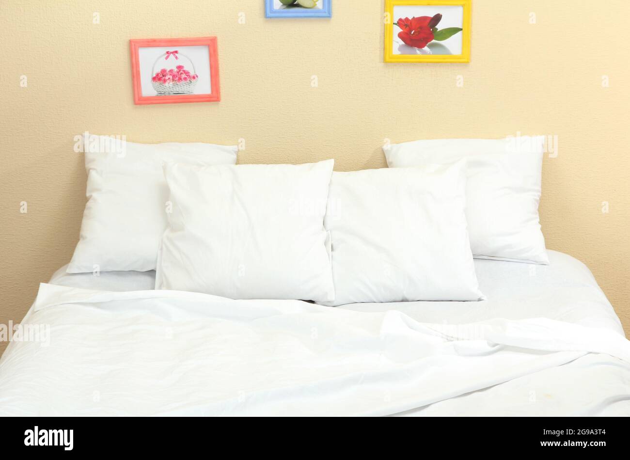 Empty bed with pillows and sheets in bedroom Stock Photo - Alamy
