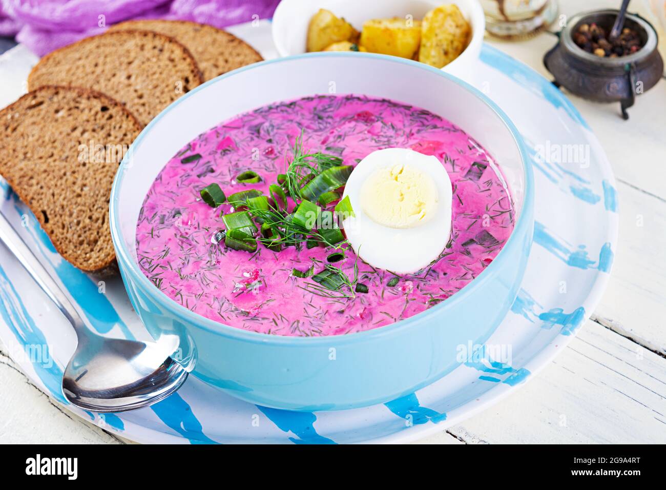 Cold borscht on white wooden background. Cold beet soup Stock Photo - Alamy