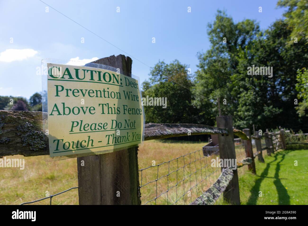 Deer prevention wire above this fence, please do not touch sign, uk ...