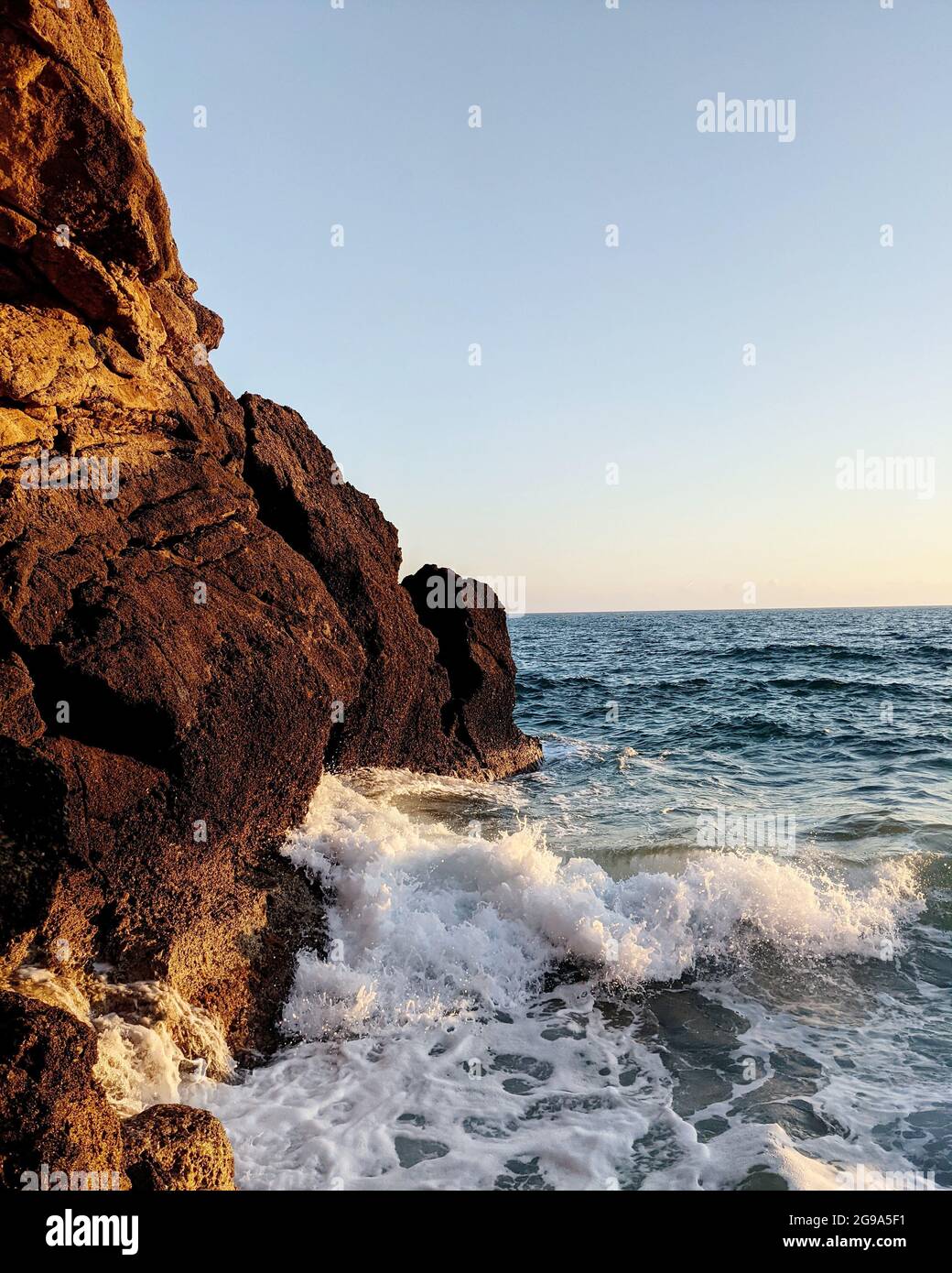 Corfu cliffs waves during golden hour Stock Photo - Alamy