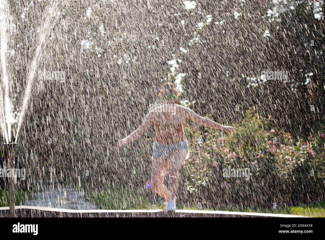 Running through water fountains hi-res stock photography and images - Alamy