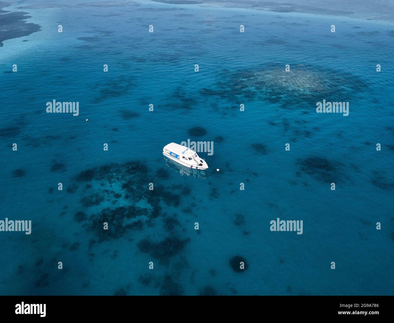 Aerial view of boat on blue water Stock Photo - Alamy