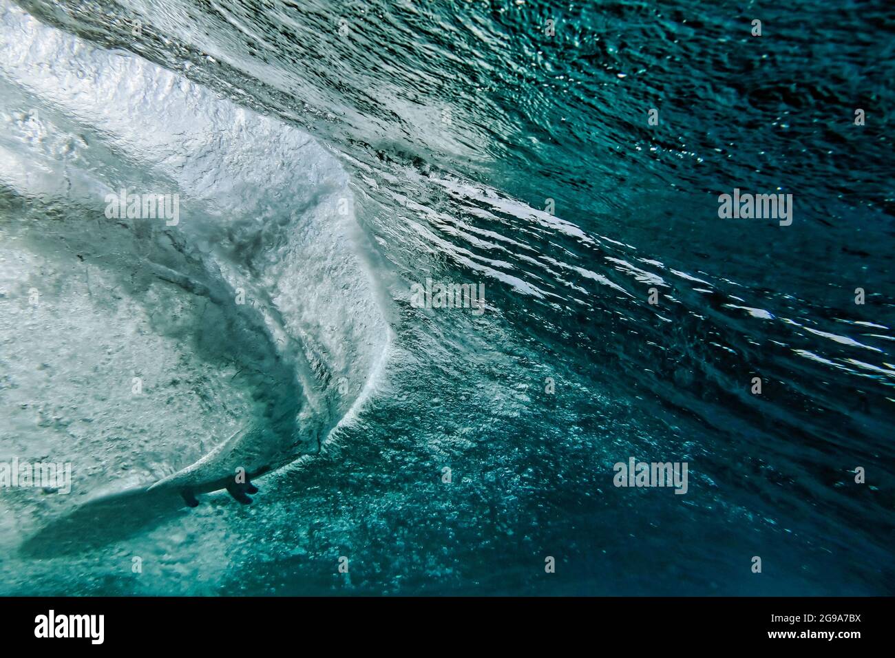Underwater view of surfer on a wave Stock Photo - Alamy