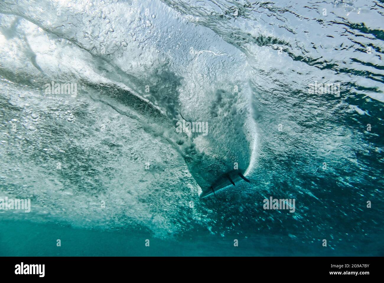 Underwater view of surfer on a wave Stock Photo - Alamy