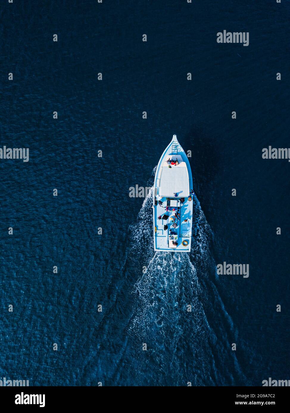 Aerial view of boat on blue water Stock Photo - Alamy