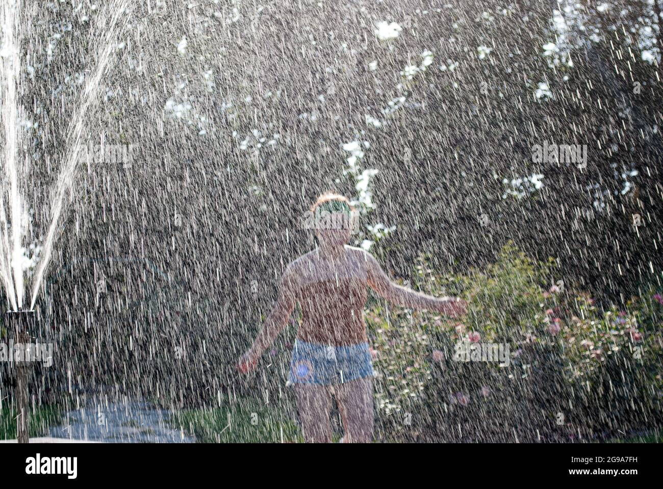 Running through water fountains hi-res stock photography and images - Alamy