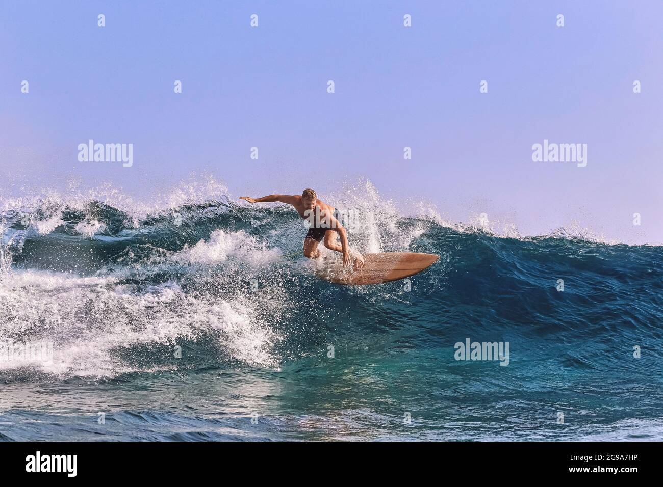 Surfer on a wave, Maldives, Indian ocean Stock Photo - Alamy
