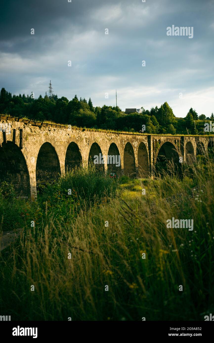 ancient stone viaduct in the rays of the setting sun Stock Photo - Alamy