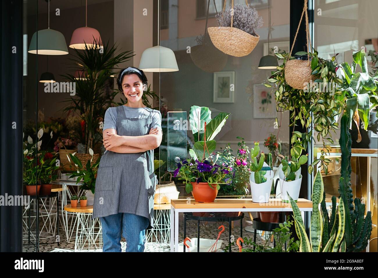 Happy florist looking camera hi-res stock photography and images - Alamy