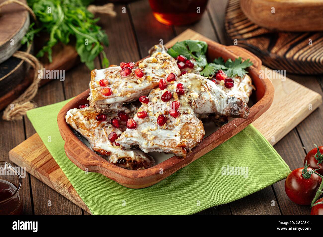 Georgian dish chkmeruli chicken with cream Stock Photo - Alamy