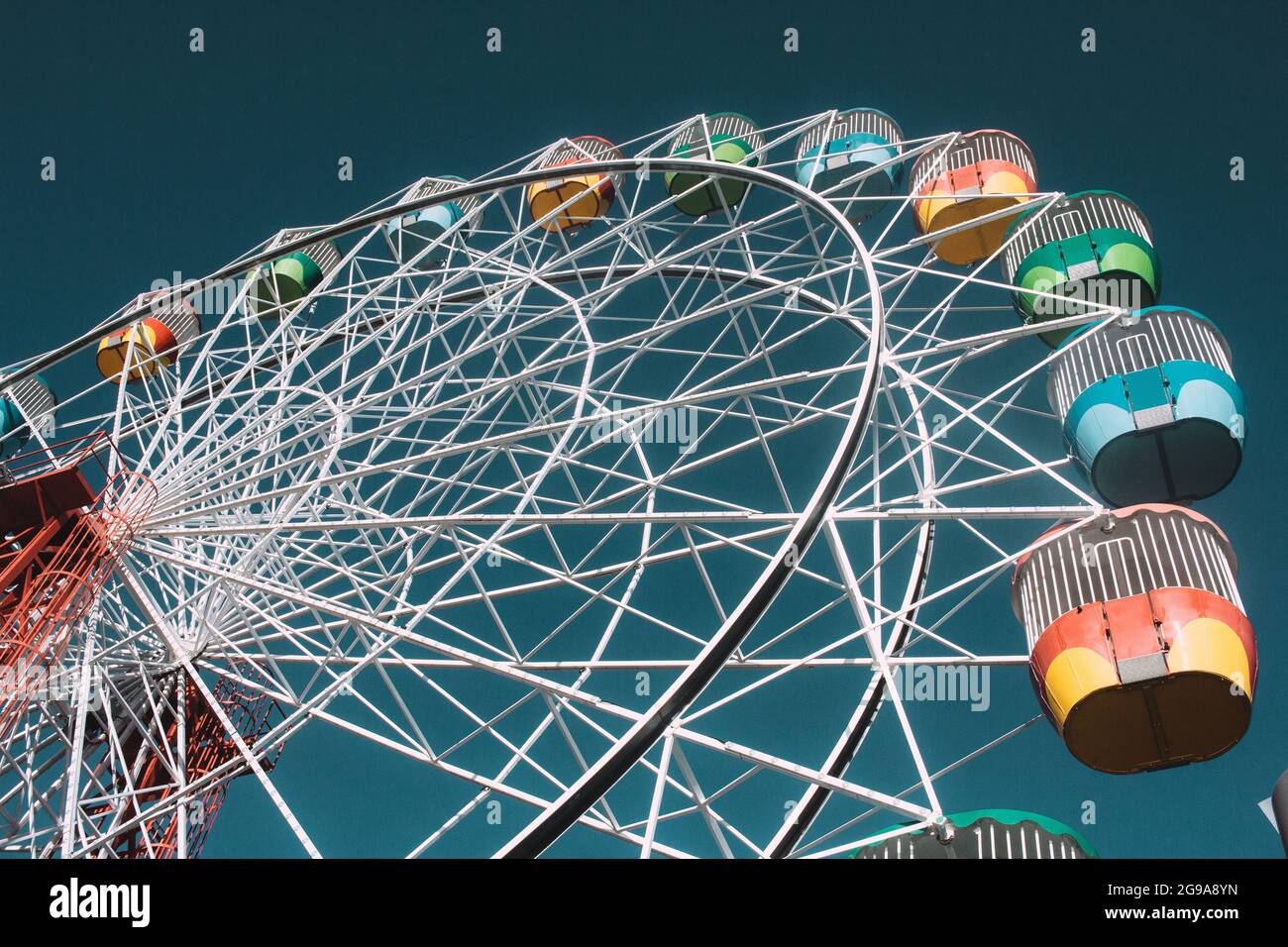 A Colourful ferris wheel carriages at an amusement park Sydney ...