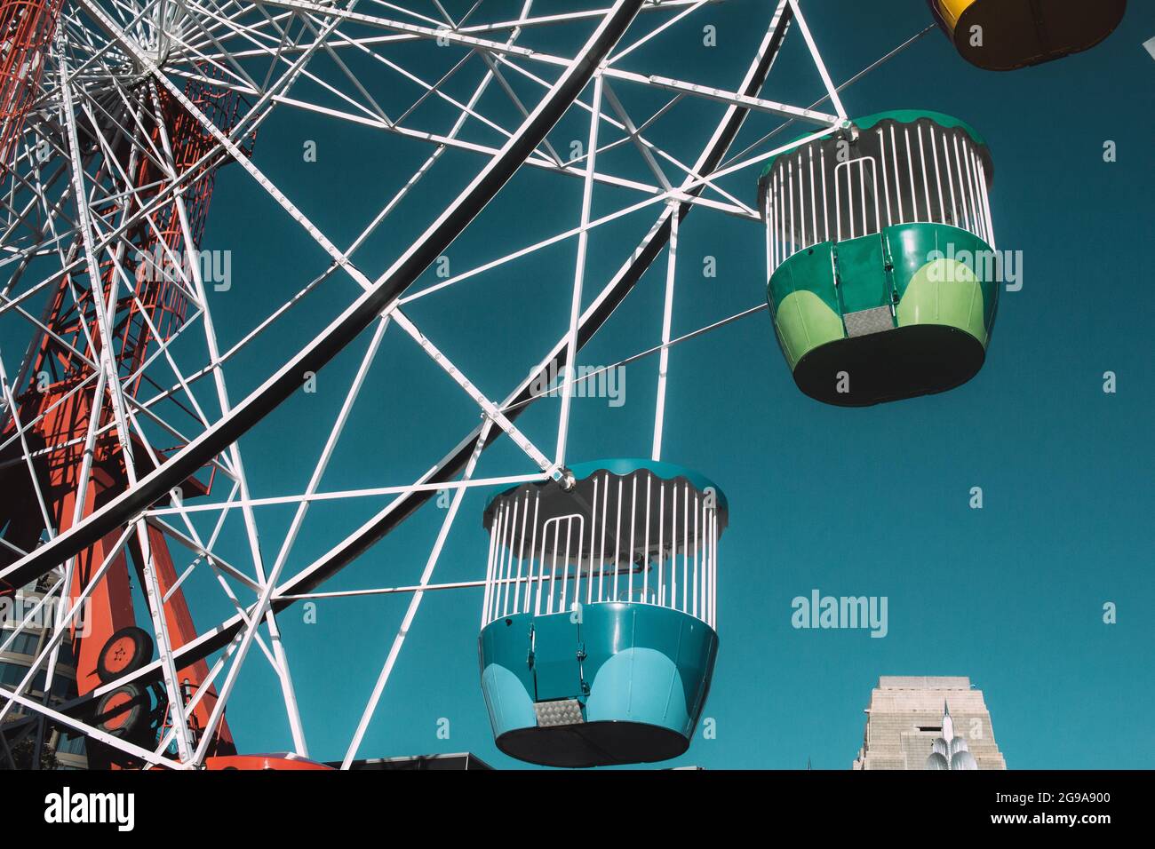 A Colourful ferris wheel carriages at an amusement park Sydney ...