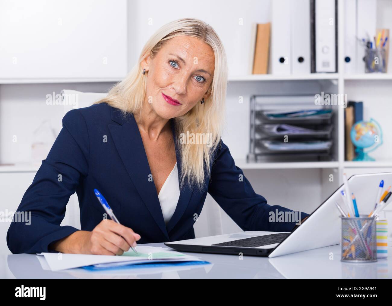 Successful business woman at workplace Stock Photo - Alamy