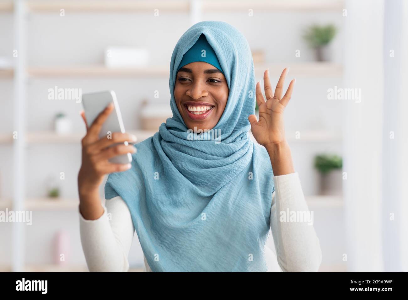 Woman in hijab making video hi-res stock photography and images - Alamy