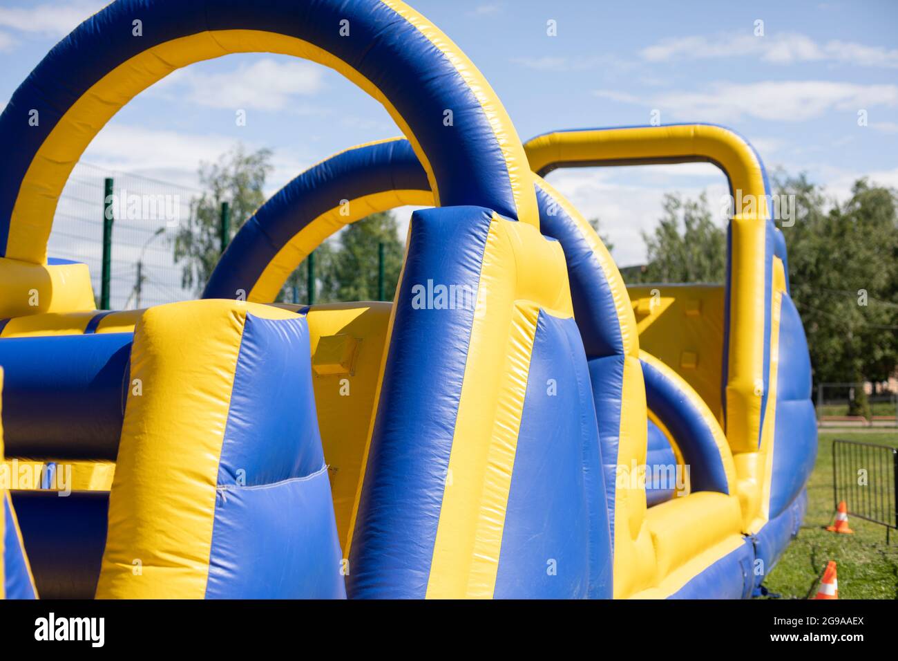 Inflatable obstacle course for fun. Inflatable structure in the park. A ...