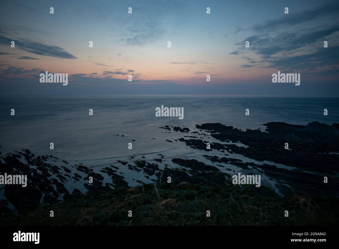 WOOLACOMBE, DEVON, UK. 22 JULY 2021. A view of the sunset at Rockham ...