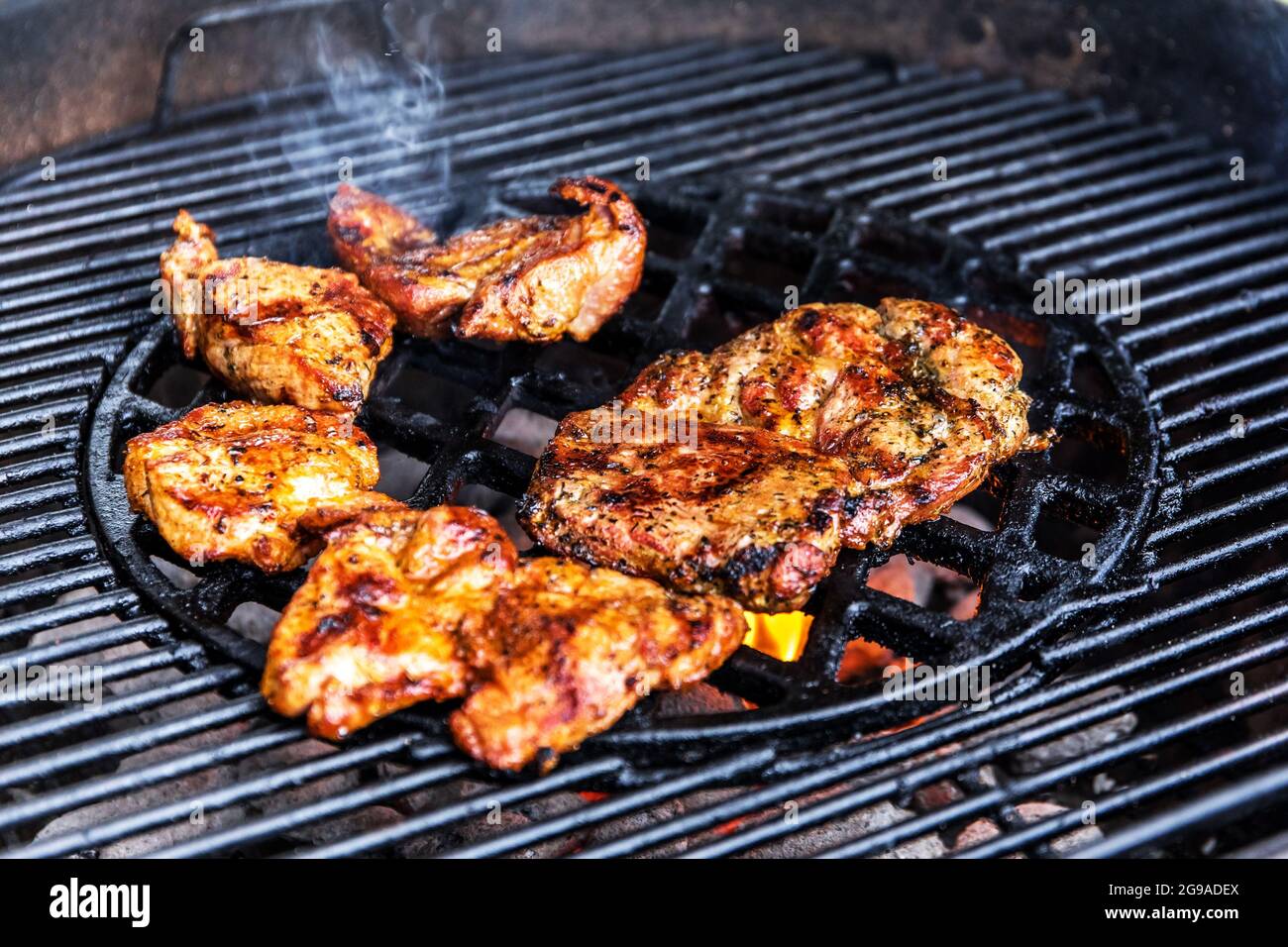 Fresh grilled meat. Preparing meat on the grill. Close-up view of a hot ...