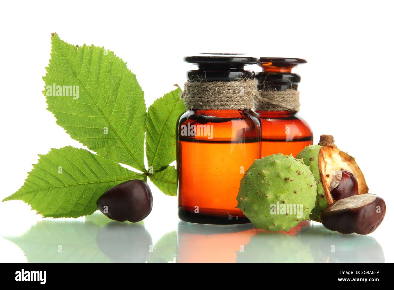medicine bottles with chestnuts and leaves, isolated on white Stock ...