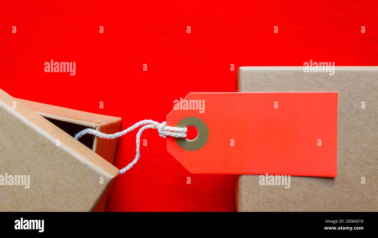 Cardboard boxes with a tag. Brown packing box with blank label and copy ...