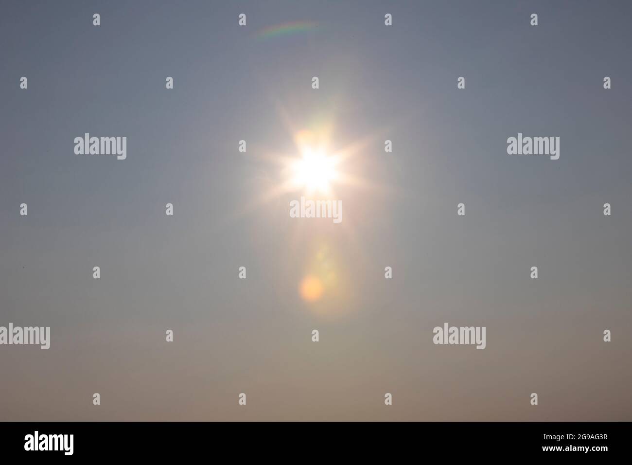 sun with beams in the sky as background Stock Photo - Alamy