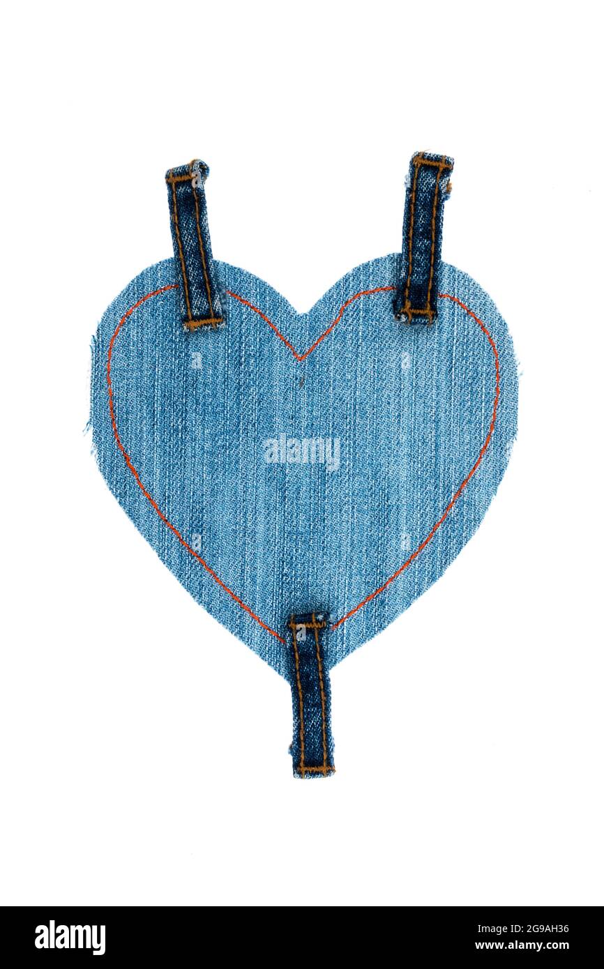 Denim heart with three straps isolated on white background. Ripped ...