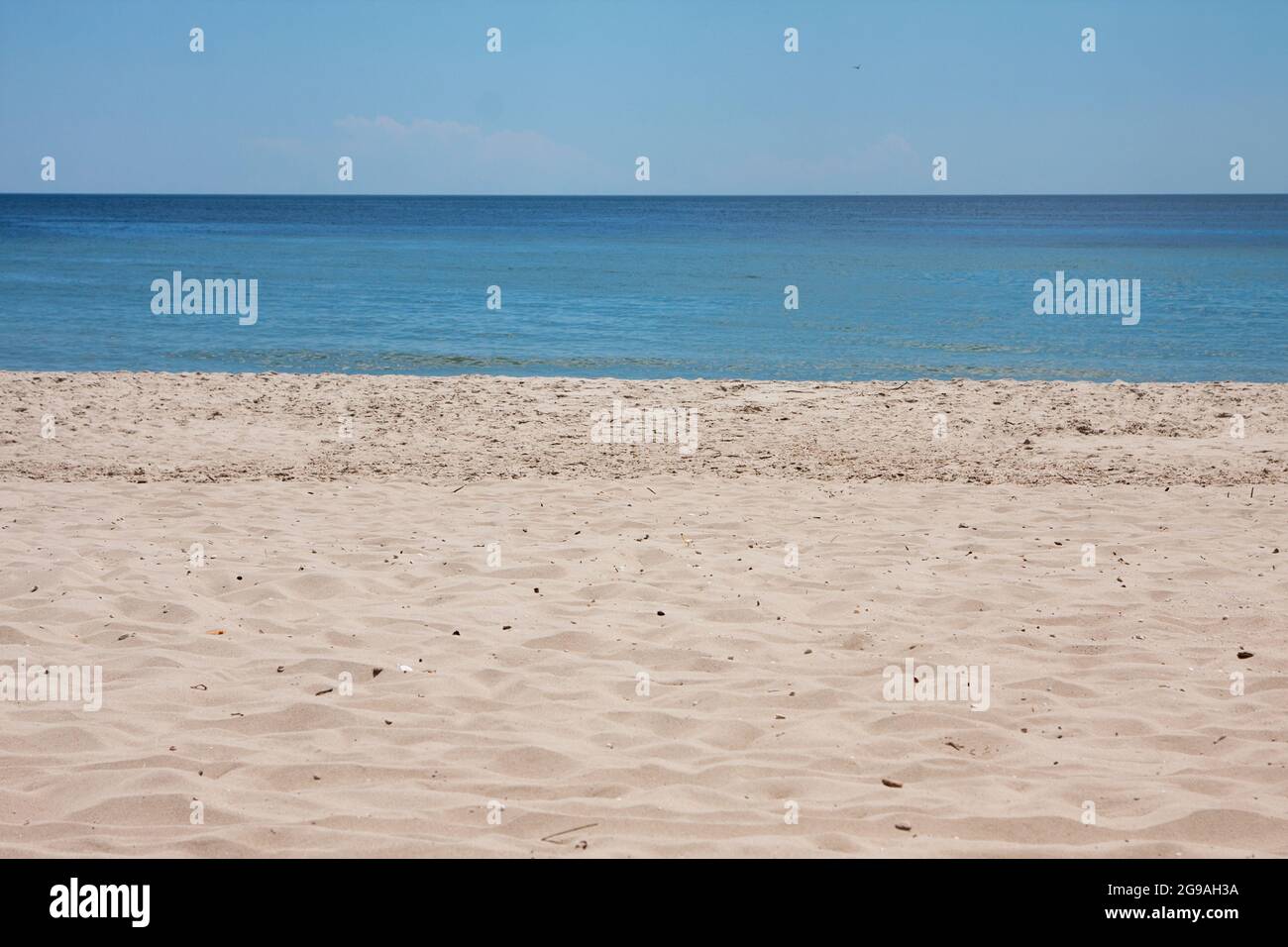 Tropical beach view. Calm and relaxing empty beach scene, blue sky and ...