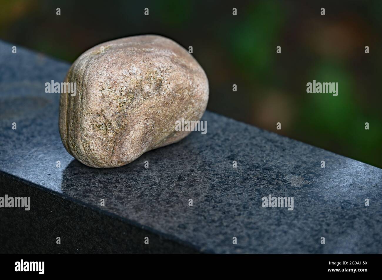 Stones on a Jewish grave to honor the dead and as an expression of ...