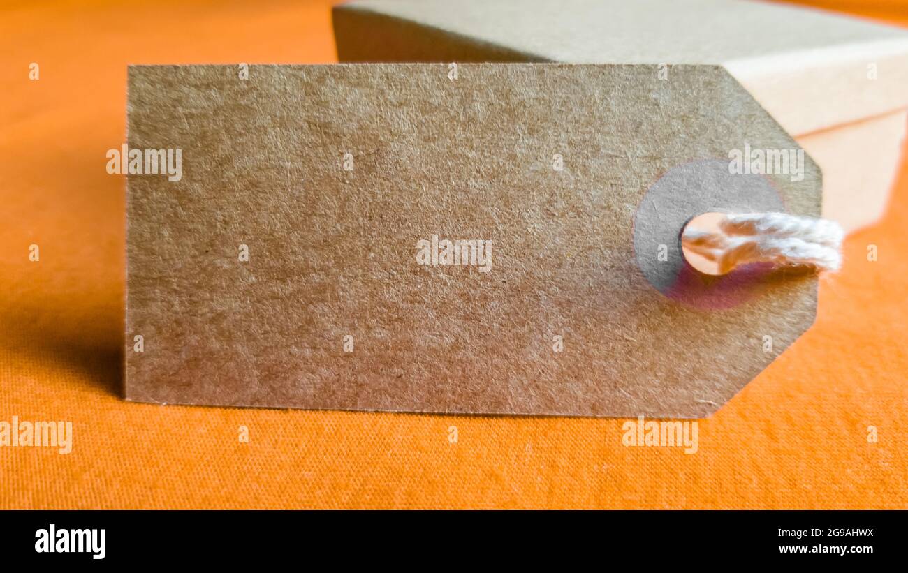 Cardboard boxes with a tag. Brown packing box with blank label and copy ...