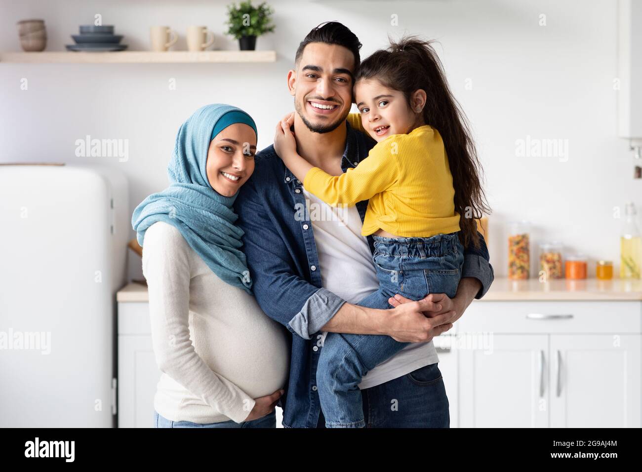 Portrait Of Happy Middle Eastern Family With Pregnant Mother And Little ...
