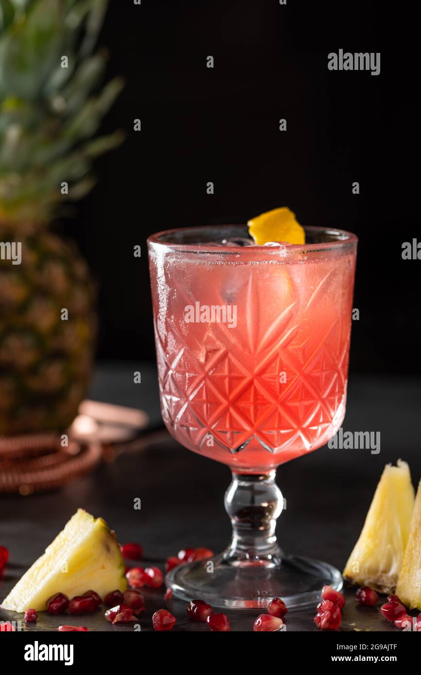 refreshing and light pomegranate and pineapple summer cocktail with ice ...