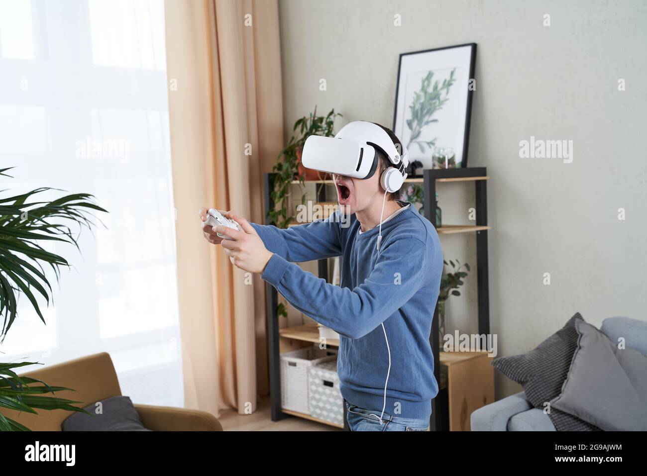 Man with virtual reality headset is playing game. Concept of virtual ...