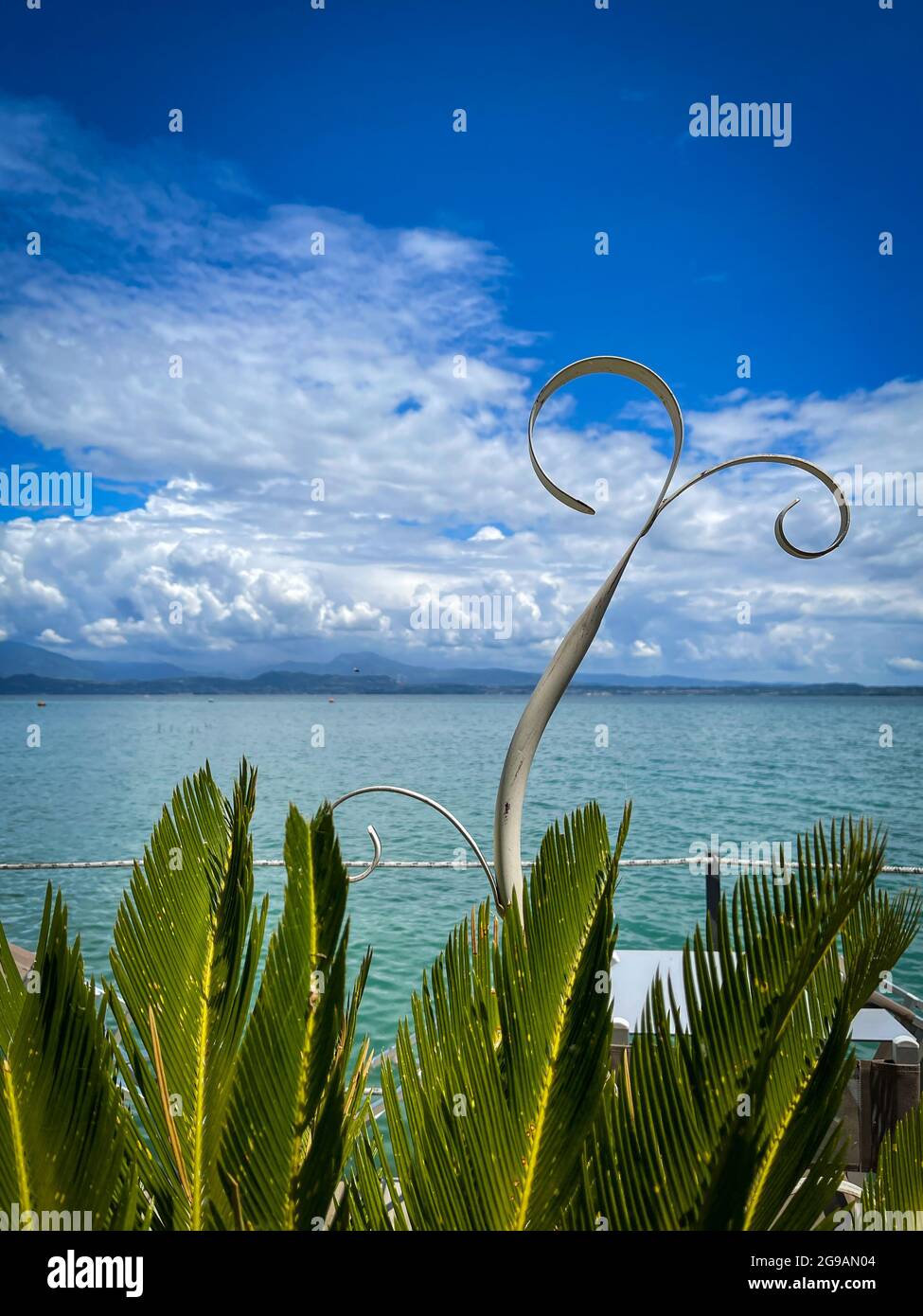 a shot of the blue Lake Garda in the most beautiful weather Stock Photo ...