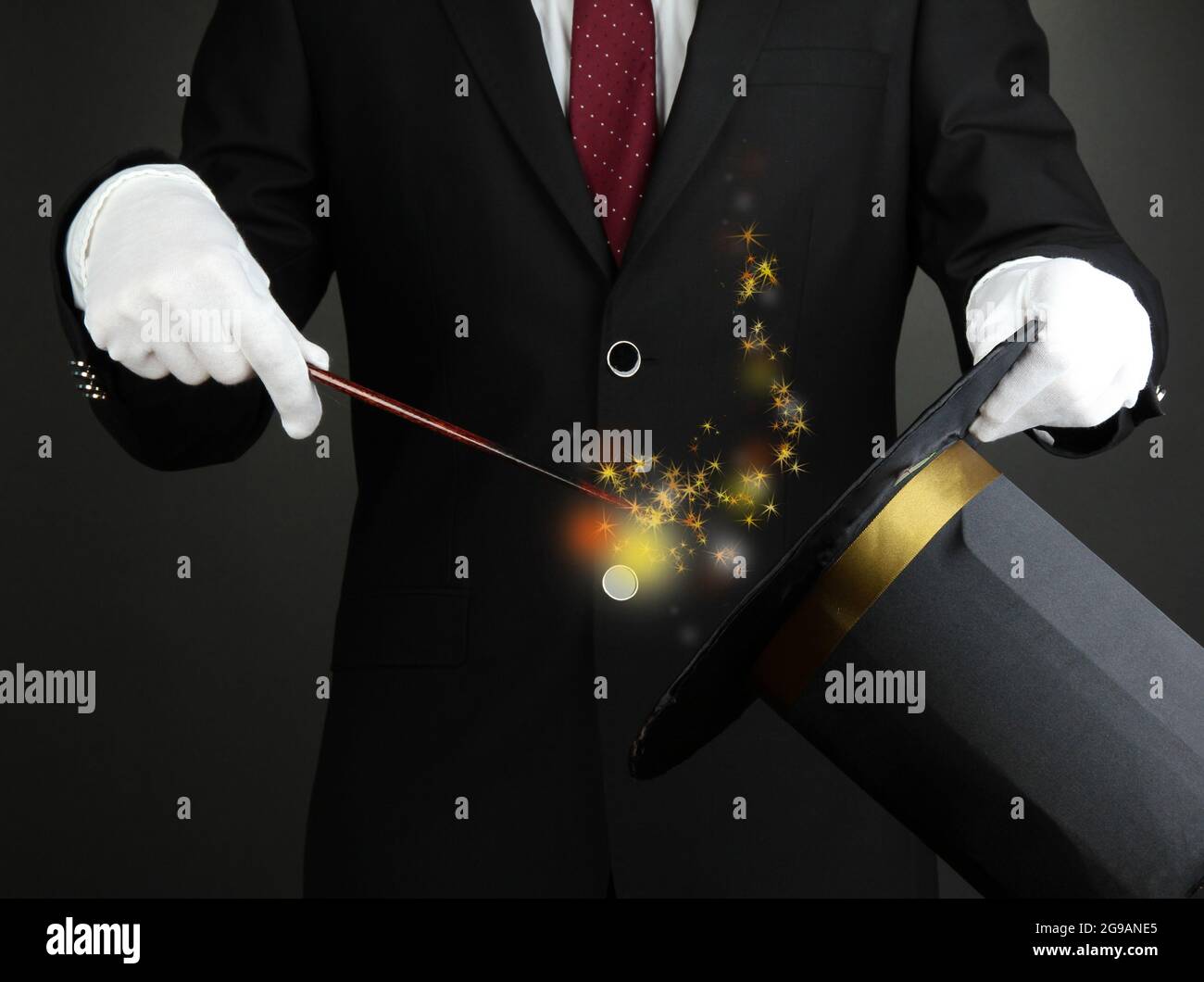 Magician performance on dark background Stock Photo - Alamy