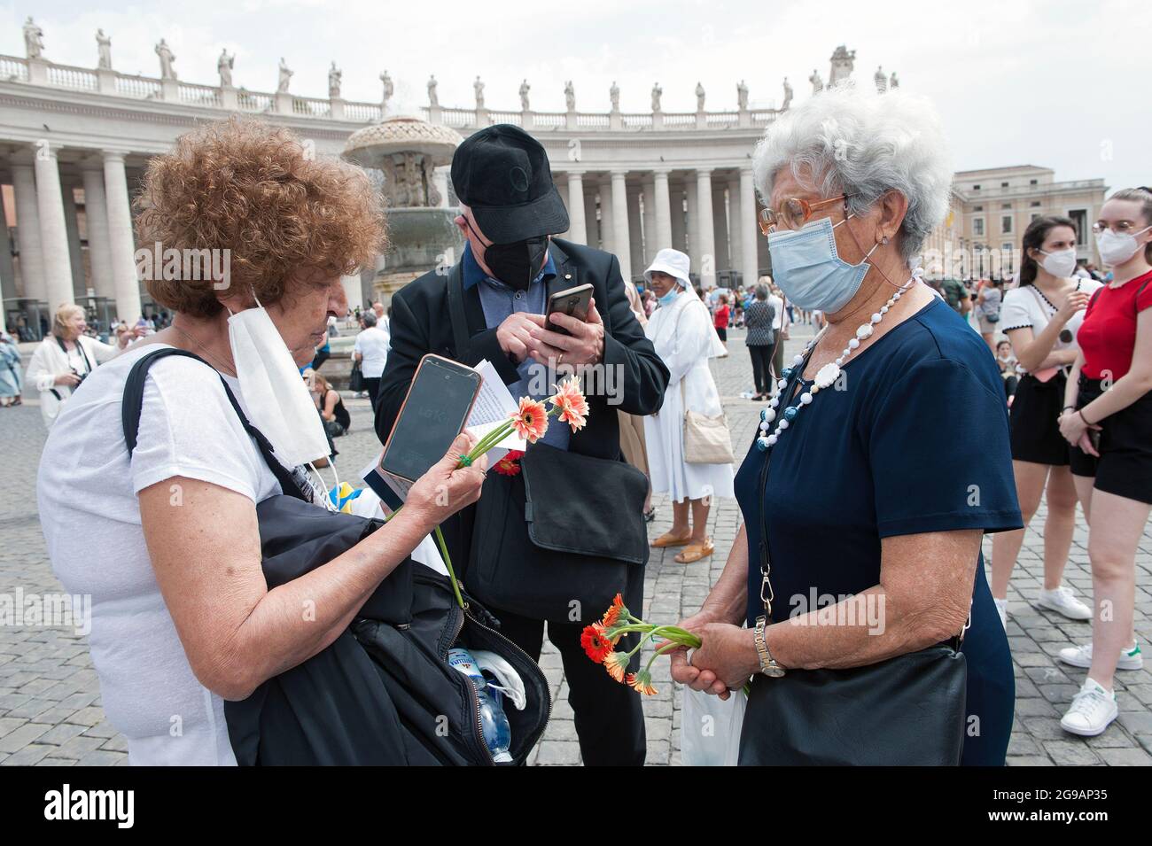 Rome, Italy. 25th July, 2021. July 25, 2021. : Faithful elders hold a ...