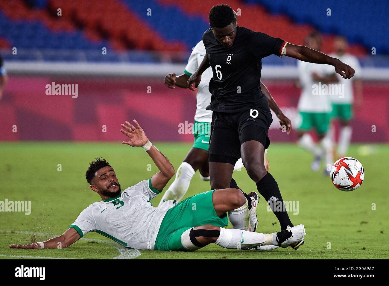 YOKOHAMA, JAPAN - JULY 25: Abdulelah Al Amri of Saudi Arabia and Ragnar ...
