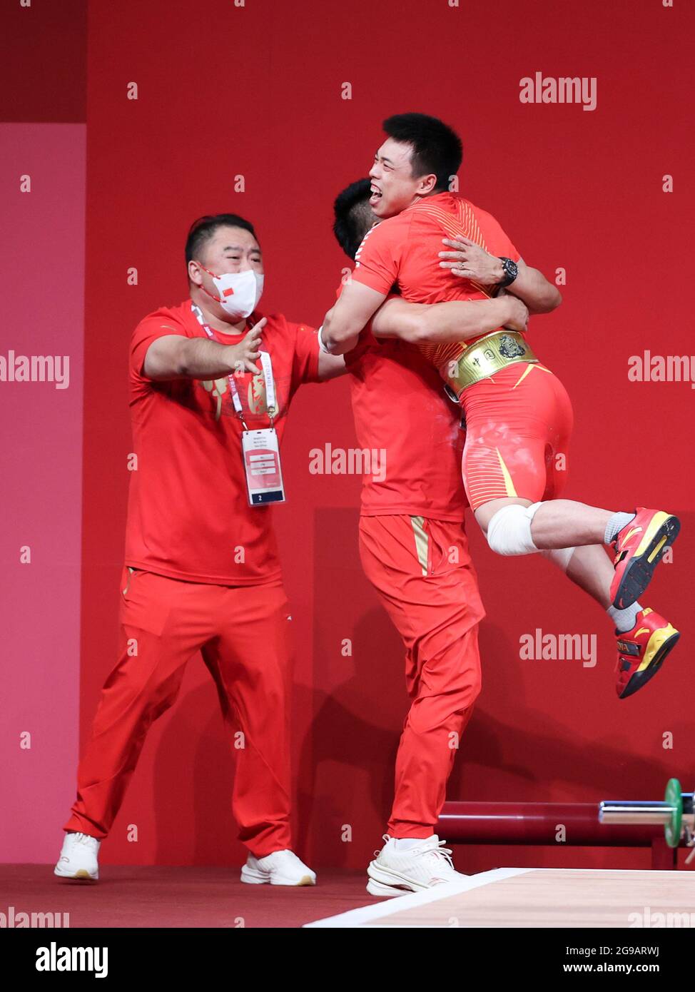 Tokyo, Japan. 25th July, 2021. Chen Lijun of China hugs his coaches ...