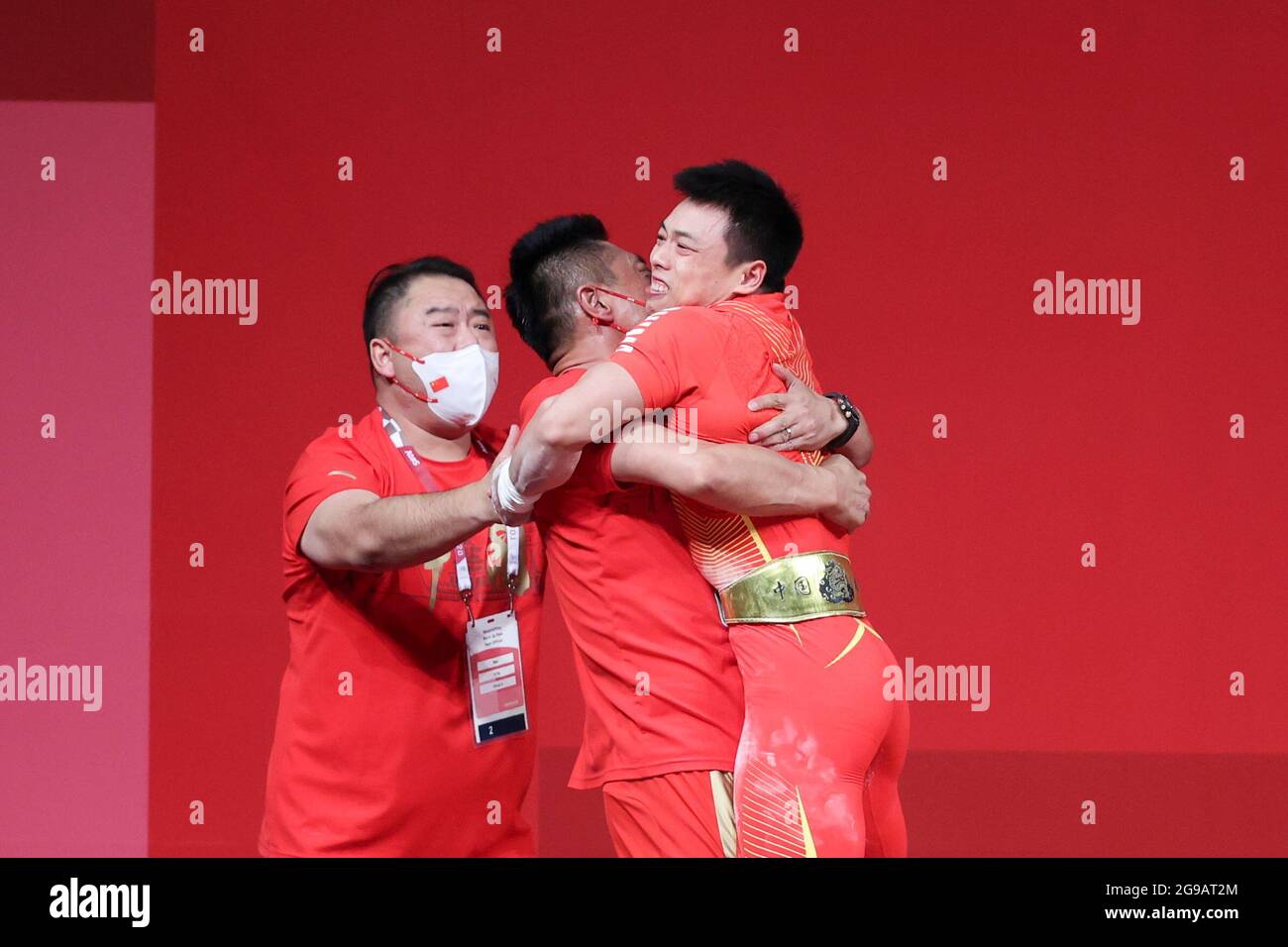 Tokyo, Japan. 25th July, 2021. Chen Lijun of China hugs his coaches ...